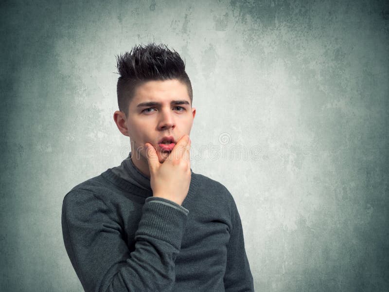Puzzled Young Man Staring Intently at the Camera Stock Image - Image of ...