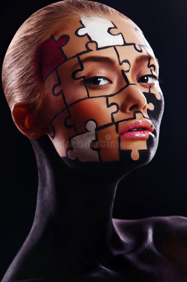 Puzzles painted on face - Stock Image - Everypixel