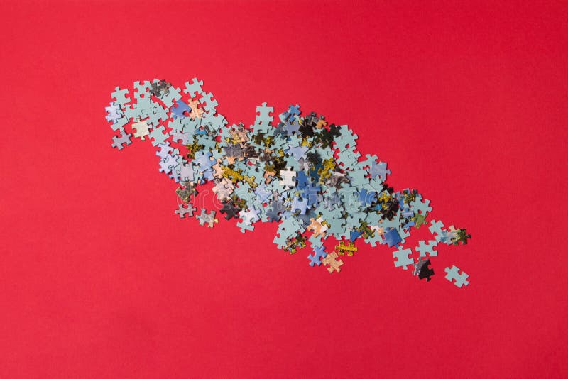 Puzzles on Red Colored Paper Background. Top View Stock Photo - Image ...