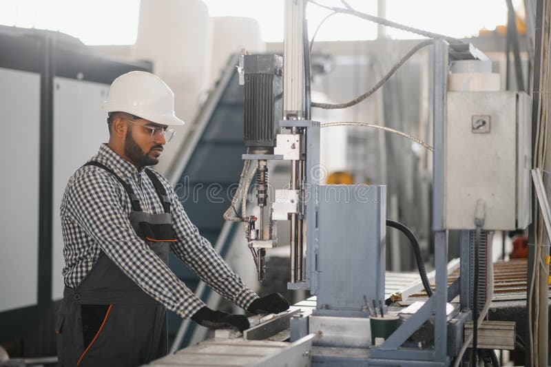 PVC Industry Worker or Operator Making Frames for Windows and Doors ...