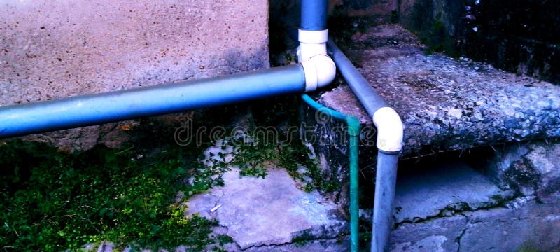 Pvc pipe laid on wall stock image. Image of cyan, hanger - 298509739