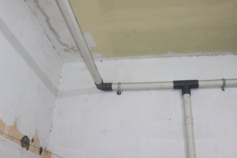 The PVC Pipe Network is Installed Attached To the Wall for Water ...