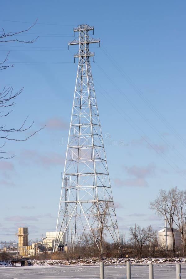 Pylon and Power Lines at an Industrial Site Stock Photo - Image of tall ...