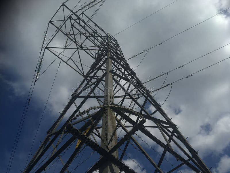 A Pylon Shot Form Beneath Silhouetted Against the Sky Stock Photo ...