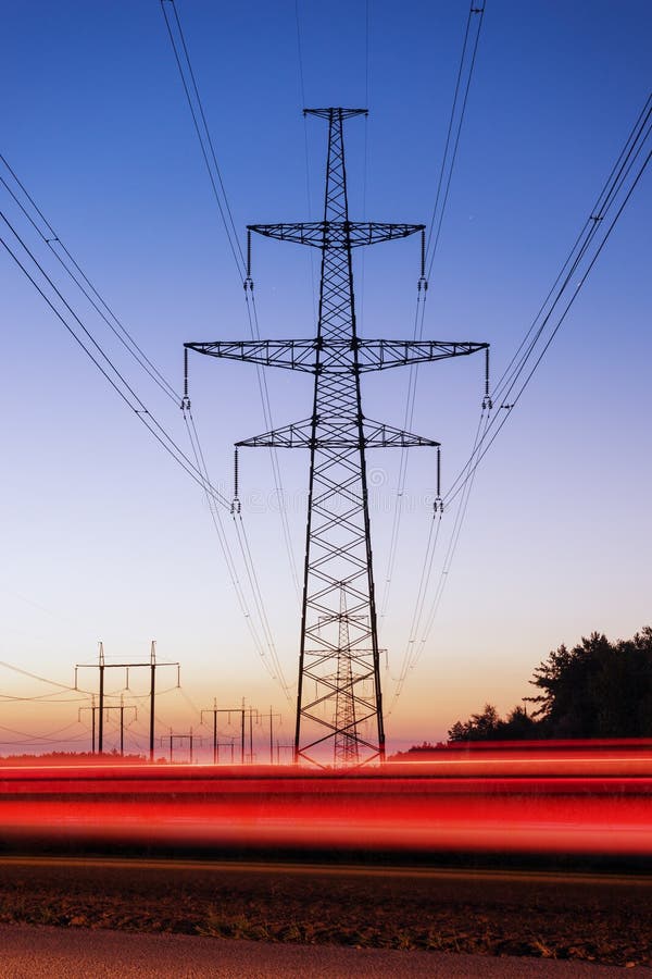 Pylon and Transmission Power Line in Sunset. Stock Image - Image of ...