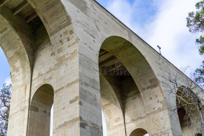 Pylons and Archways Under a Bridge Stock Image - Image of bridges ...