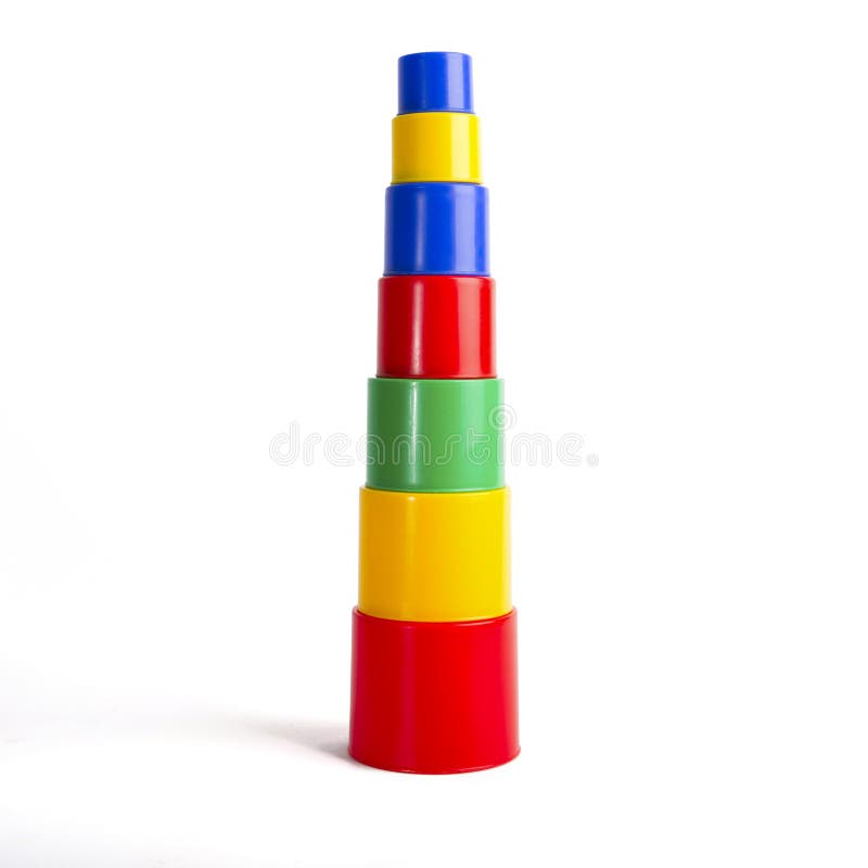Pyramid Build from Colored Plastic Isolated on White Background. Stock ...