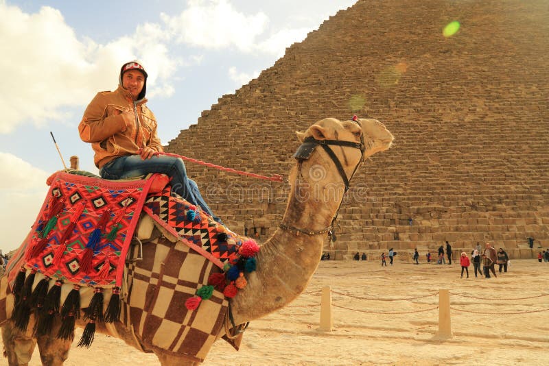 Pyramid and camel rider editorial image. Image of antiquities - 67396105