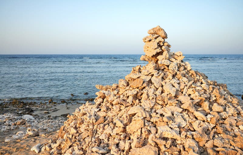 Pyramid of Coral and Stones on the Beach, Selective Focus, Egypt Stock ...
