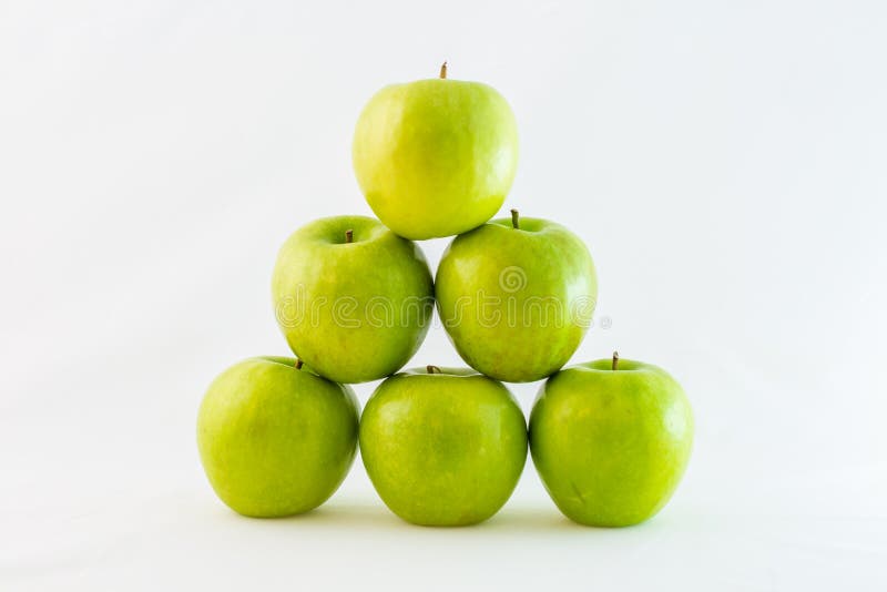 Red Apple Standing Out from Row of Green Apples. Stock Image - Image of ...