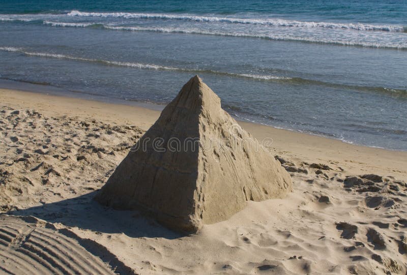 Pyramid Shaped Sand Castle stock photo. Image of sand - 3415540