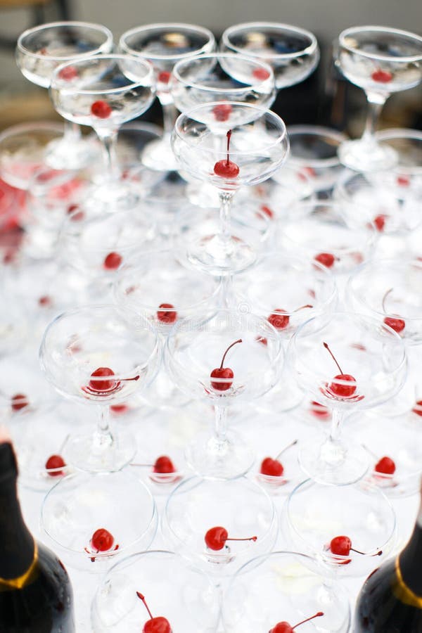 Pyramid of Martini Glasses with Cherries on the Wedding Table Stock ...