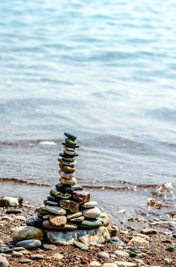 Pyramid of Pebbles on the Beach. Stock Photo - Image of arrangement ...