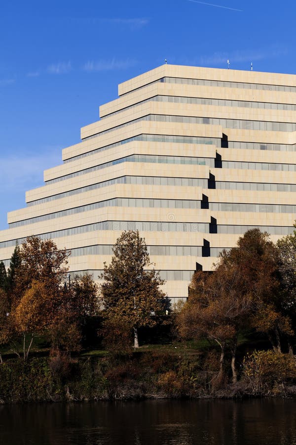 Pyramid Office Building with River and Blue Sky Stock Image - Image of ...