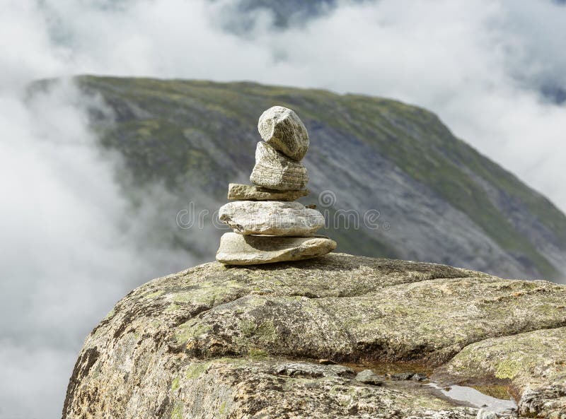 Pyramid of Pebbles on the Beach.Waves in Background Stock Image - Image ...