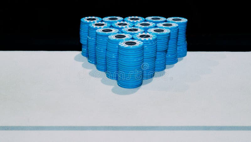 Pyramid of Piles of Blue Poker Chips on Table with Copy Space Stock ...