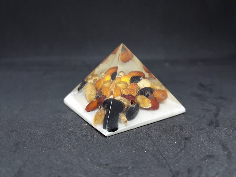 Pyramid with seeds inside stock photo. Image of crystal - 129463206