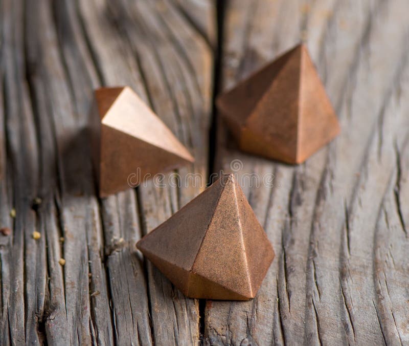 Pyramid Shaped Chocolate Desert on a Wooden Table Stock Image - Image ...