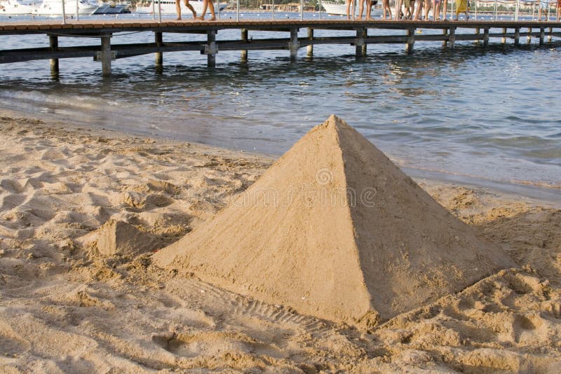 Pyramid Shaped Sand Castle stock photo. Image of sand - 3415540