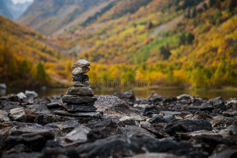 Pyramid on the Shore of a Mountain Lake in the Autumn Forest Stock ...
