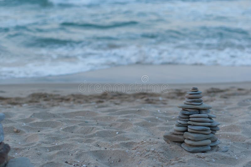 Pyramid of small stones stock image. Image of water, coast - 68911169