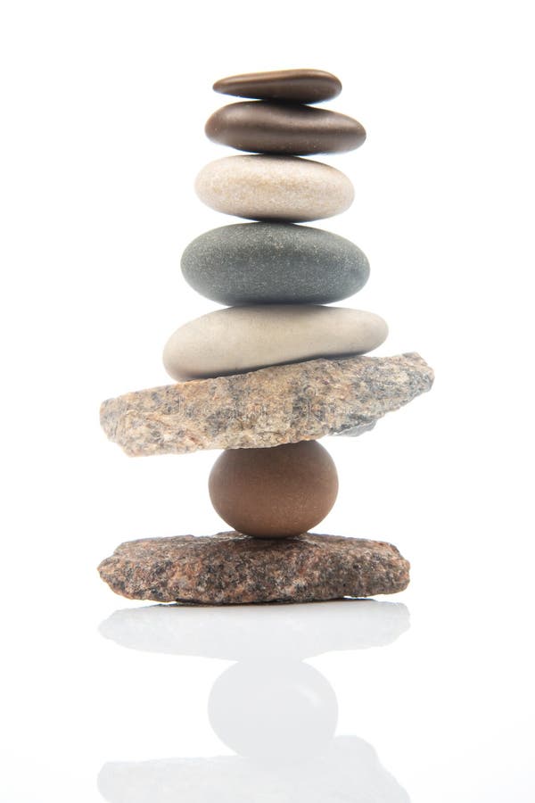 Pyramid of Stacked Stones on a White Background. Stabilization and ...