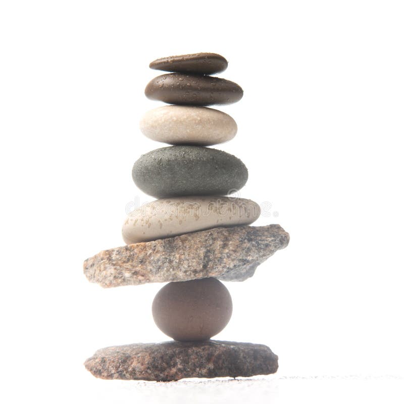 Pyramid of Stacked Stones on a White Background. Stabilization and ...