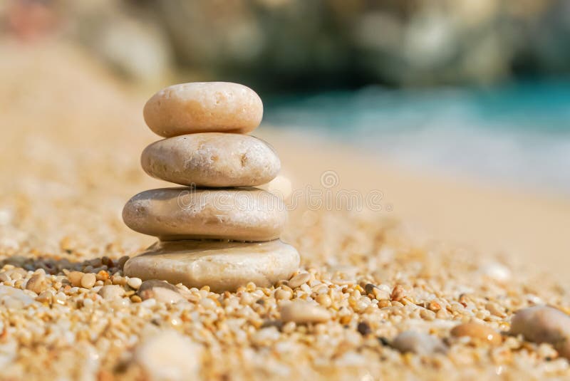 Pyramid Stones Balance on the Sand of the Beach Stock Image - Image of ...