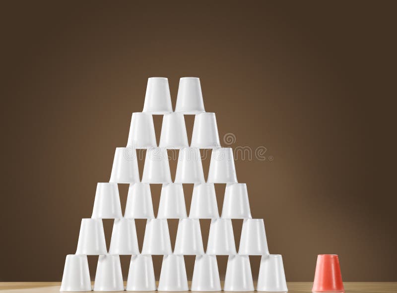 Pyramid of White Plastic Cups on Table Next To Single Red Cup Stock ...