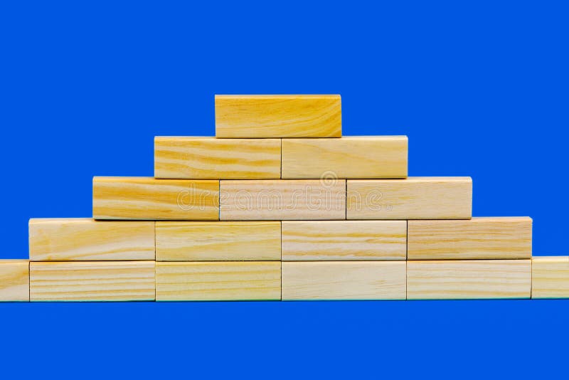 Pyramid of wooden blocks stock photo. Image of balance - 134024924