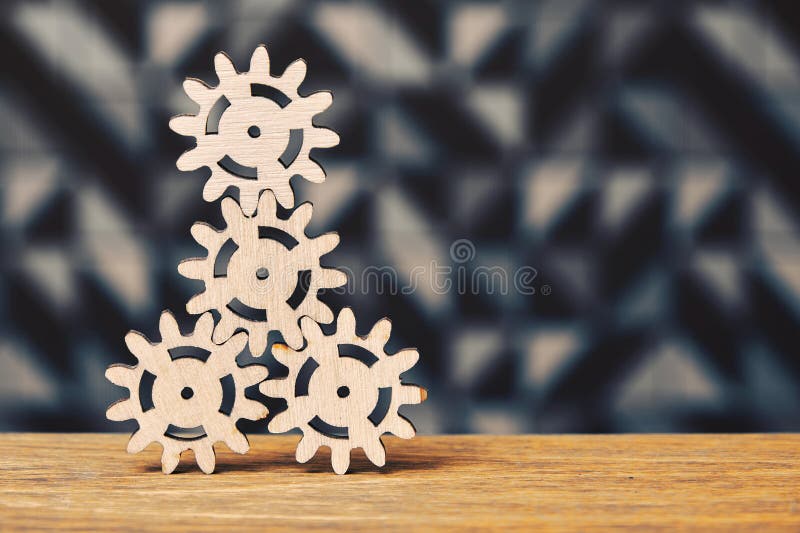 Pyramid of Wooden Toy Gears on the Table. Complex System and Mechanism ...