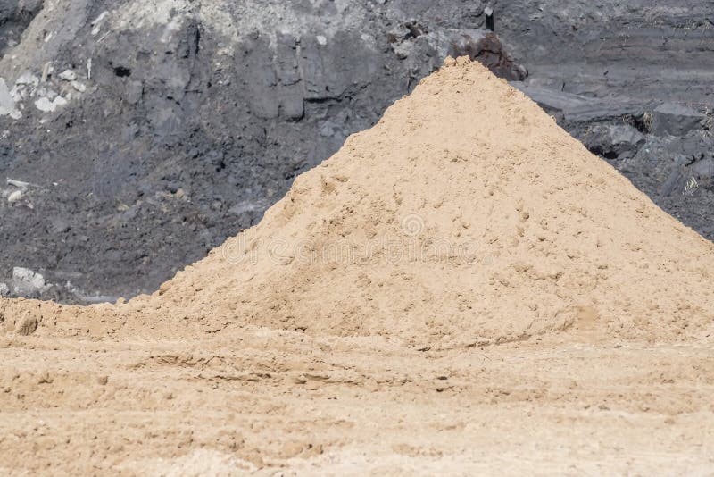 Pyramid of Yellow Construction Sand Stock Photo - Image of heap, gray ...
