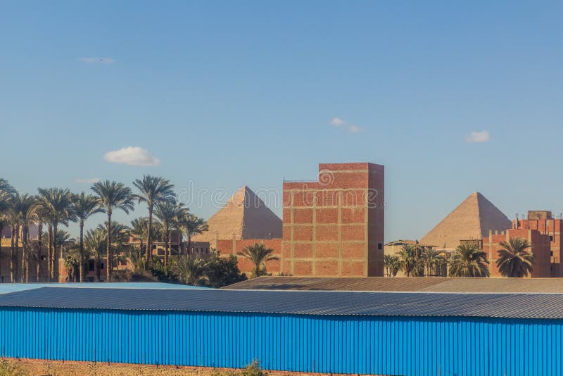 Pyramids Behind Buildings of Giza, Egy Stock Image - Image of unesco ...