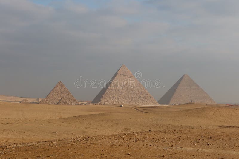 The Pyramids of Egypt Side by Side in the Middle of Desert Sand with ...