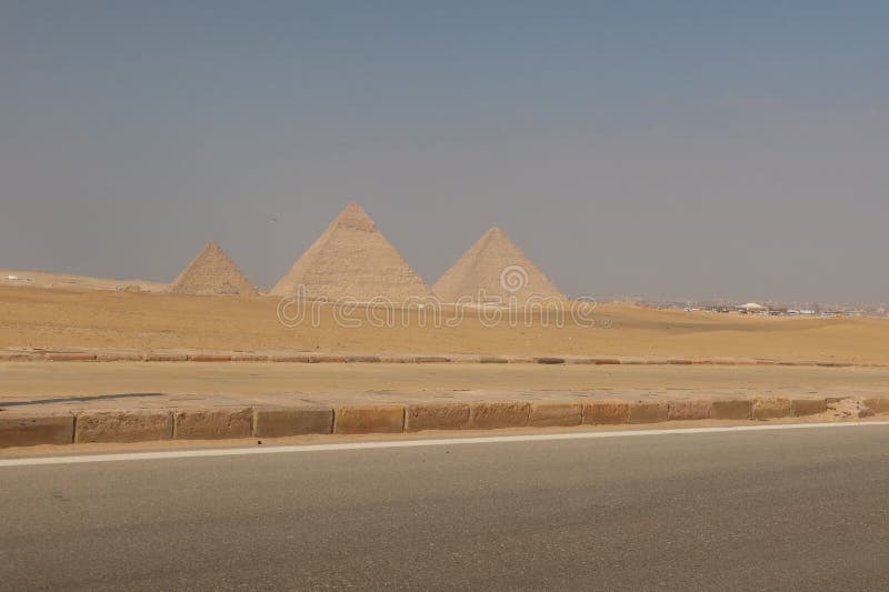The Pyramids of Egypt Side by Side in the Middle of Desert Sand with ...