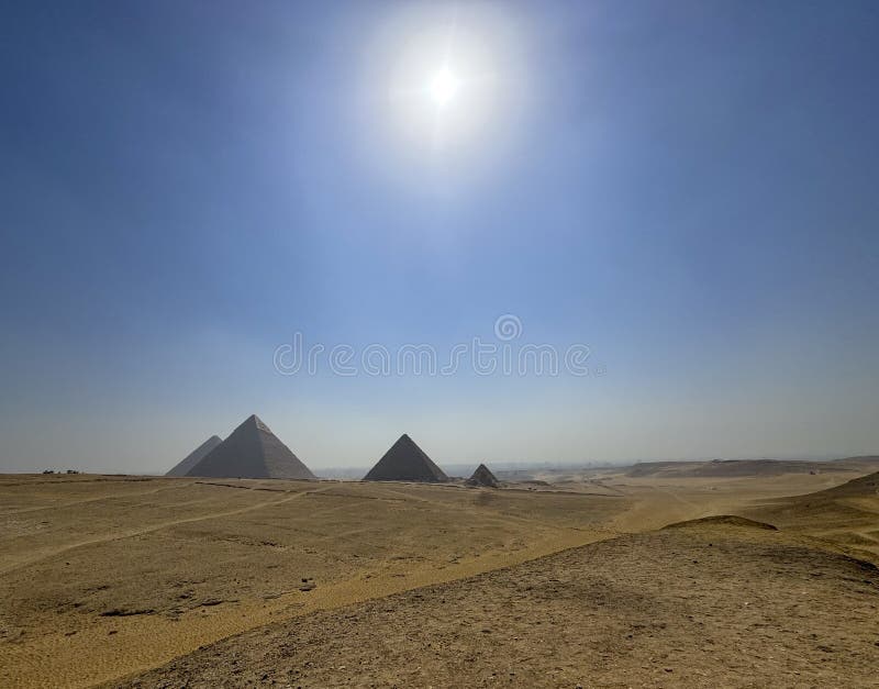 Pyramids of Giza with Blue Sky and Desert in the Foreground Stock ...