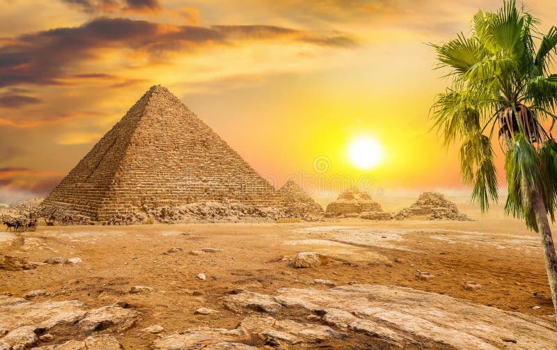Pyramids and sun stock photo. Image of architecture - 215818706