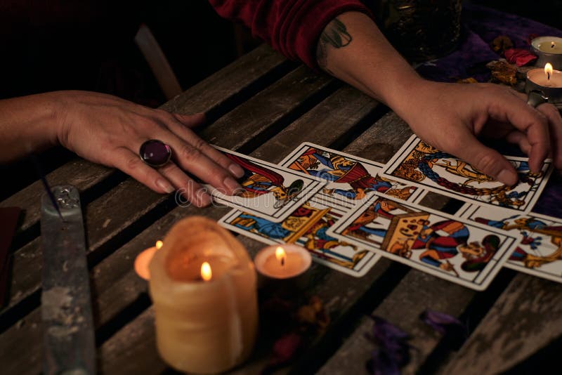 Pythoness Reads Tarot Cards on a Table with Candles Stock Photo - Image ...