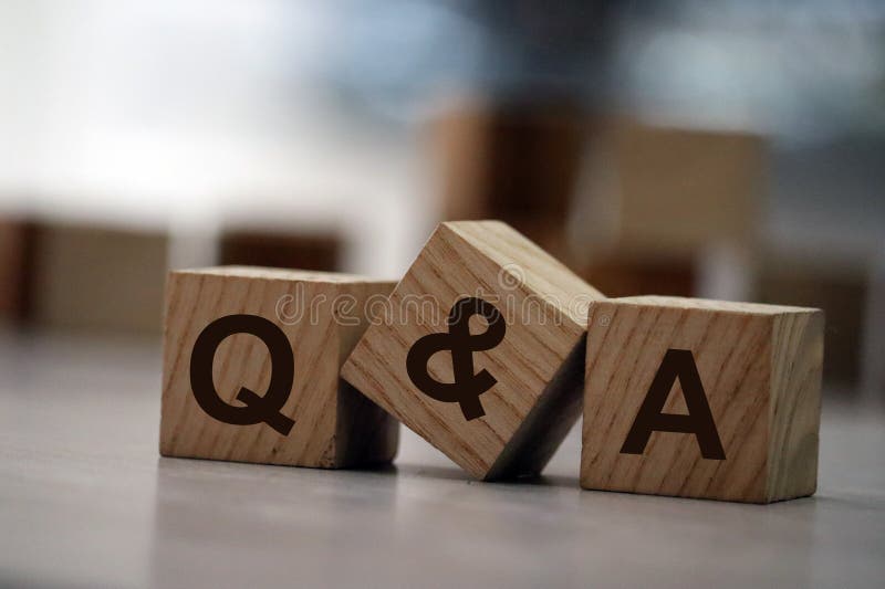 Q and a - an Abbreviation of Wooden Blocks with Letters on a Gray ...