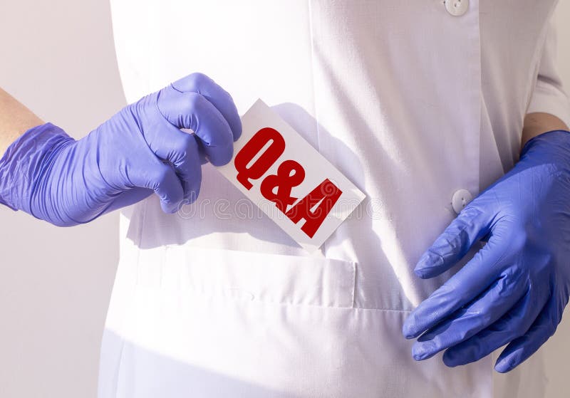 Q and a on Paper Card in Doctor Hands, Questions and Answers Concept ... Q and a on Paper Card in Doctor Hands, Questions and Answers Concept ...