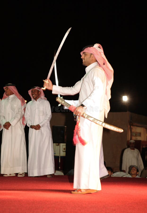 Qataris dance the Arda editorial stock image. Image of bedouin - 4758899