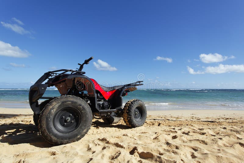 Quad on a beach (ATV) stock photo. Image of swings, ride - 4885344