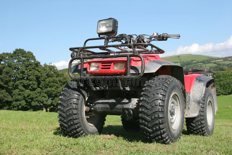 Red atv on highlands- quad stock image. Image of terrain - 6511505