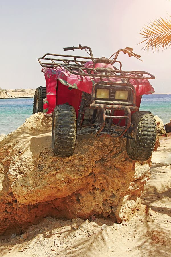 Quad Bike ATVs on Rock on Beach of Sea Stock Image - Image of quad ...