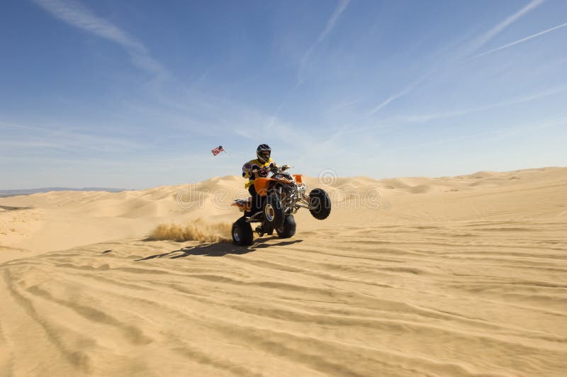 Quad Bike Rider Doing Wheelie in Desert Stock Image - Image of quad ...