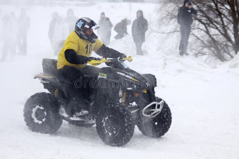 The Quad Bike S Driver Rides Over Snow Track Editorial Stock Image ...