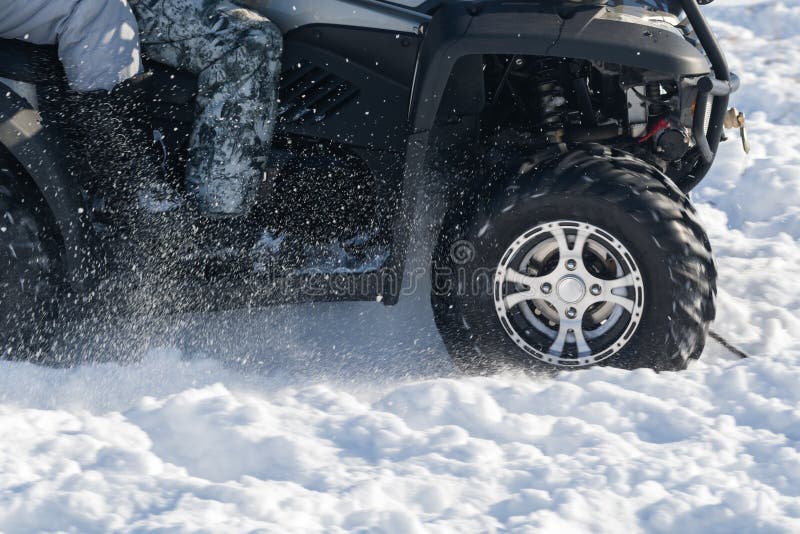 Quad bike in snow stock photo. Image of racer, speed - 66699786