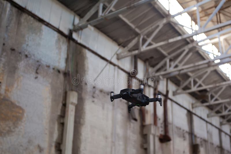 Quad-copter Drone with Camera Flying Inside Industrial Building Stock ...