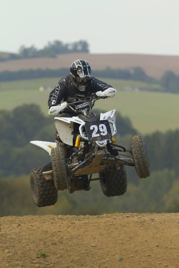 Quad jump (vertically) editorial photography. Image of drive - 21281172