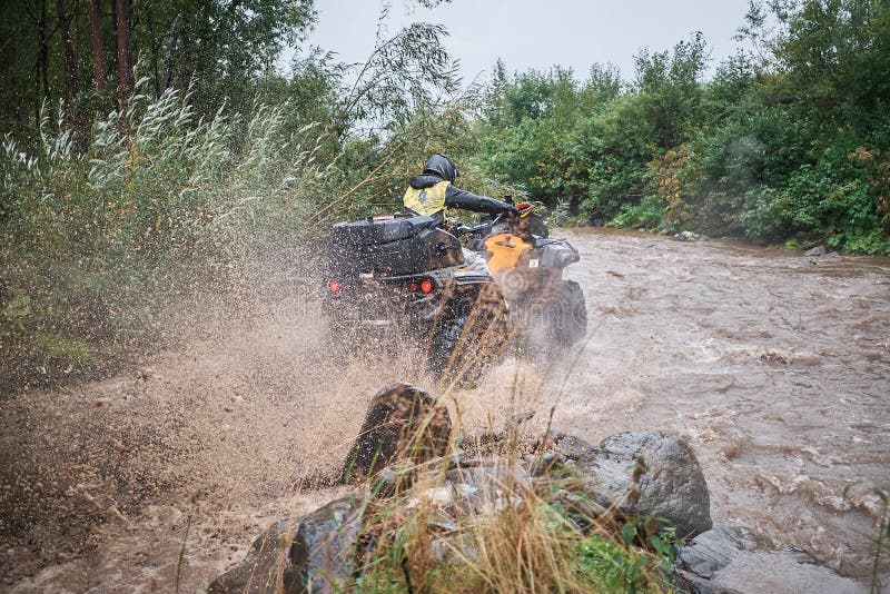 Quad Rider Jumping on a Muddy Forest Trail Editorial Photography ...